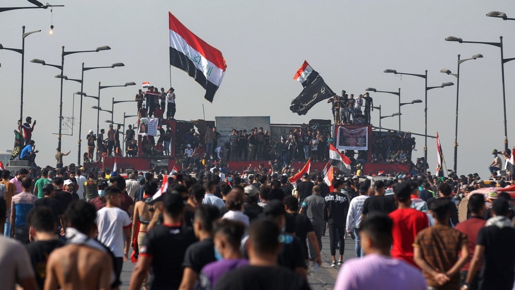Iraqis rally to relaunch year-old anti-government revolt